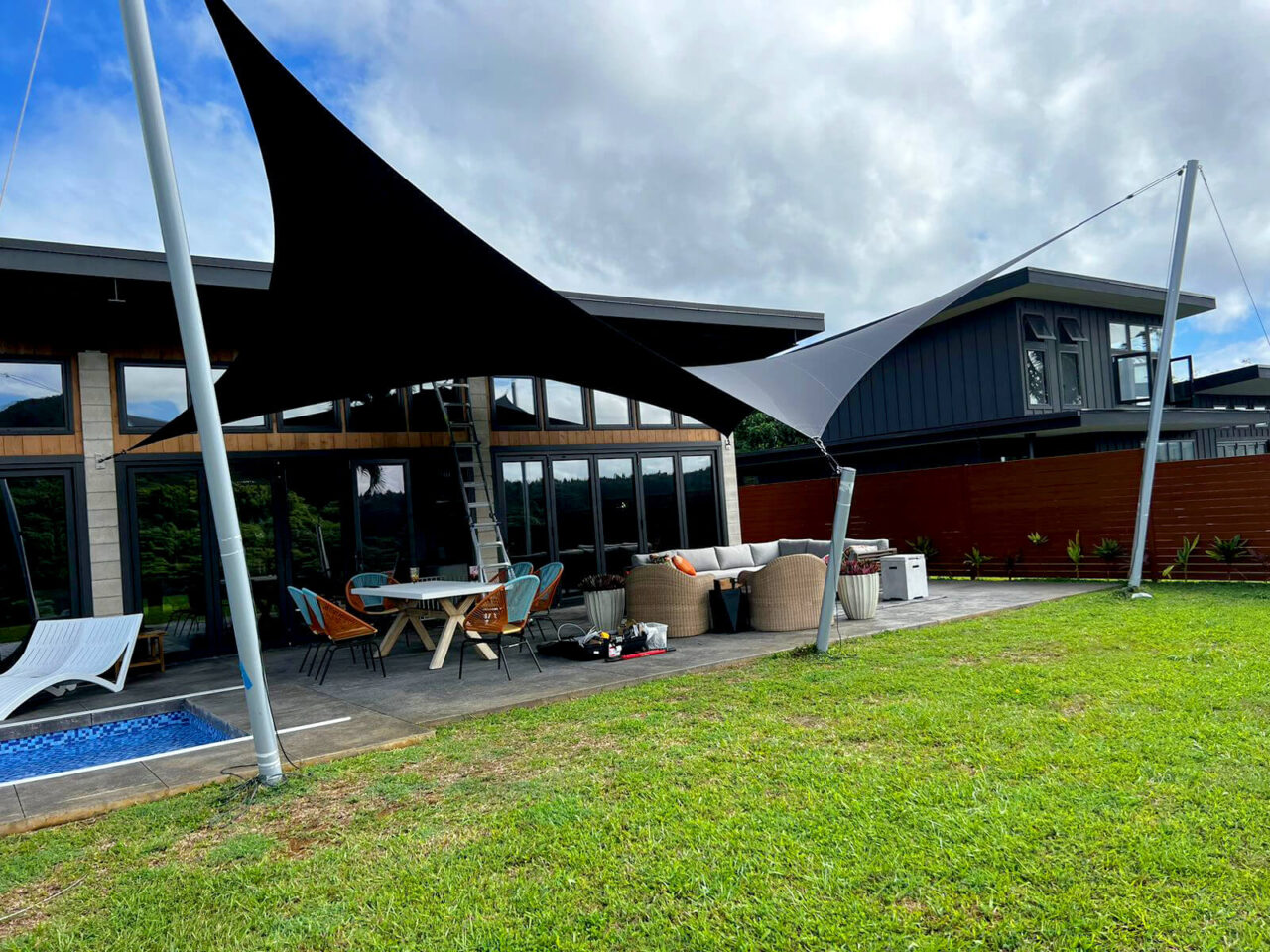 Semi-permanent removable shade sail structure for a lanai area of a ...